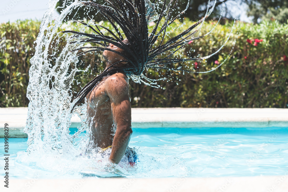 Rastafari Man Throwing Water with his Hair in Swimming Pool. Lifestyle ...