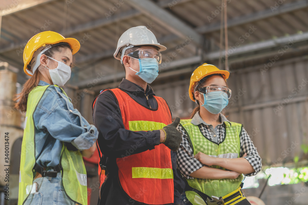 Group of Asian male and female engineers wearing hygienic mask protect ...