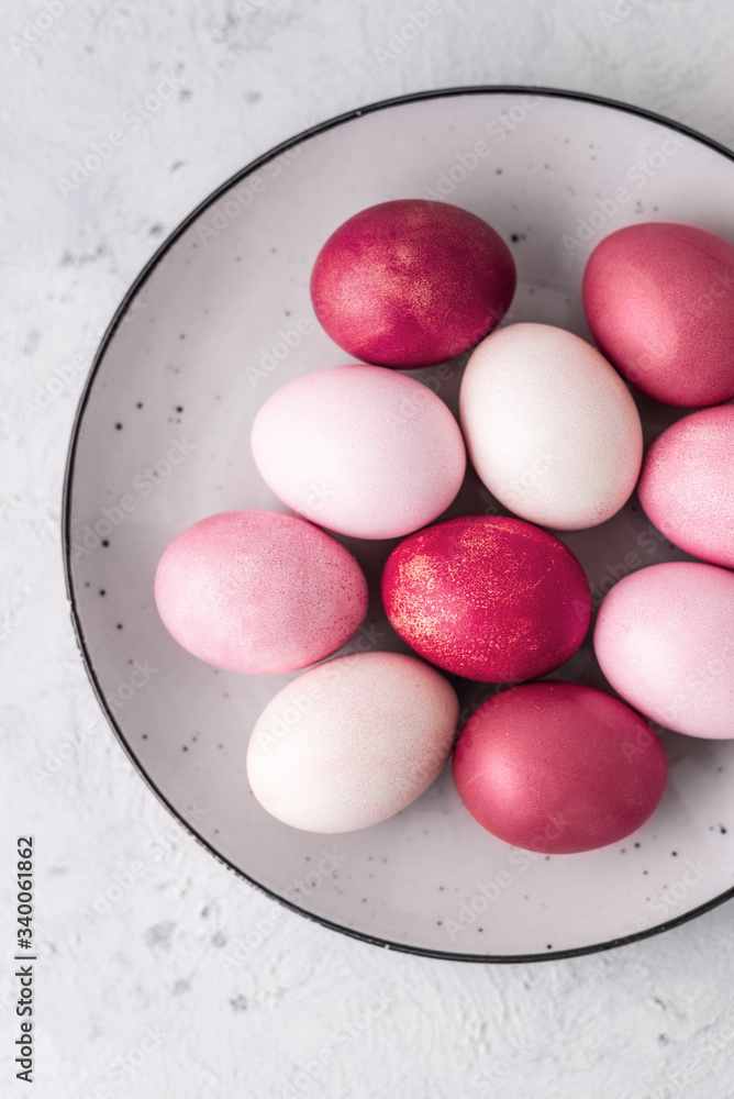Stylish eggs with ombre pink effect on white background. Natural ...