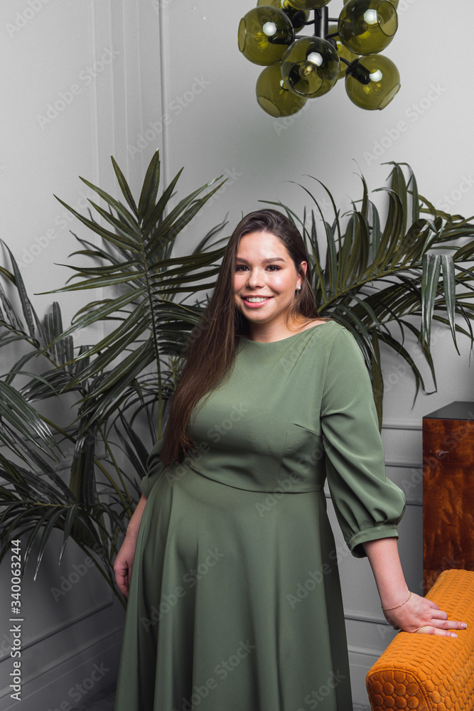 Plus size fashion model in casual clothes, woman on studio background ...