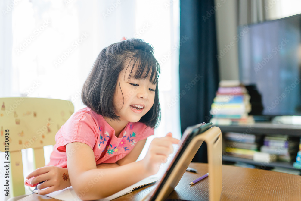Online education, Online learning.Little asian girl studying homework ...