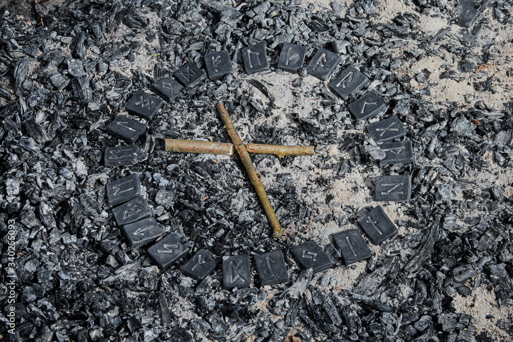 Norse rune Nautiz on ashes backgorund inside the circle of 24 Norse ...