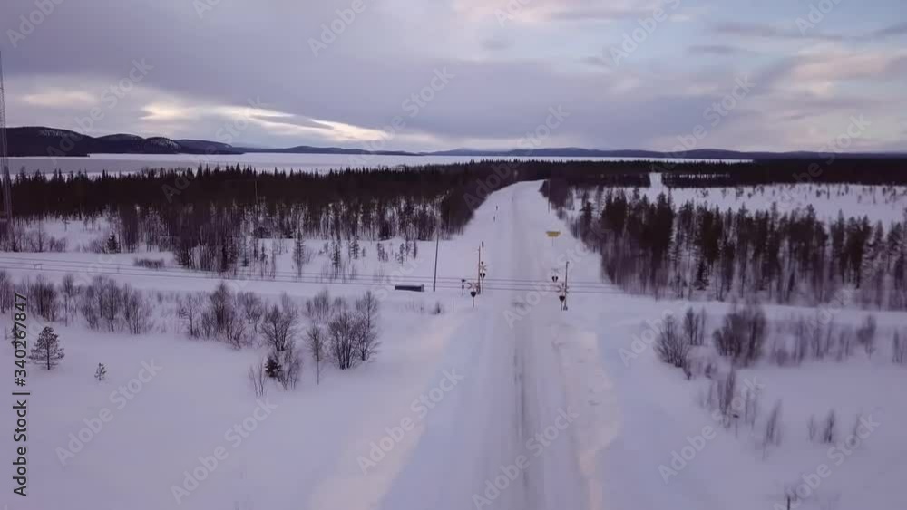 People on the icy road of Stora Sjöfallet National Park on a winter ...