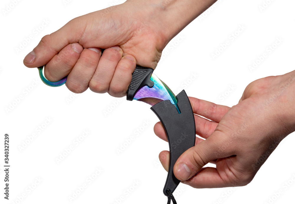 knife karambit gradient in the hand is isolated Stock Photo | Adobe Stock