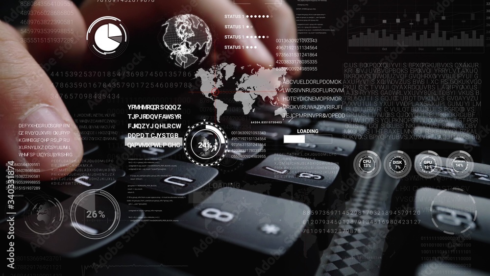 Man working on laptop computer keyboard with graphic user interface GUI ...