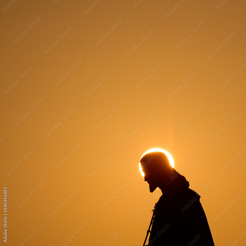 Jesus sculpture with sun nimbus. Religion theme background Stock Photo ...