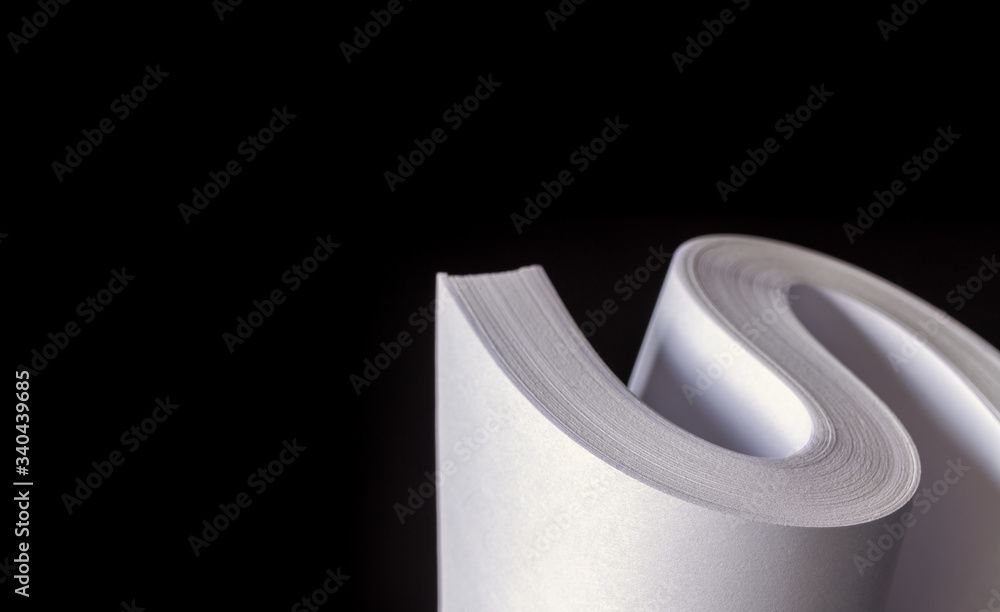 Foto de Studio photo of multiple sheets of rolled A4 paper stack (S ...