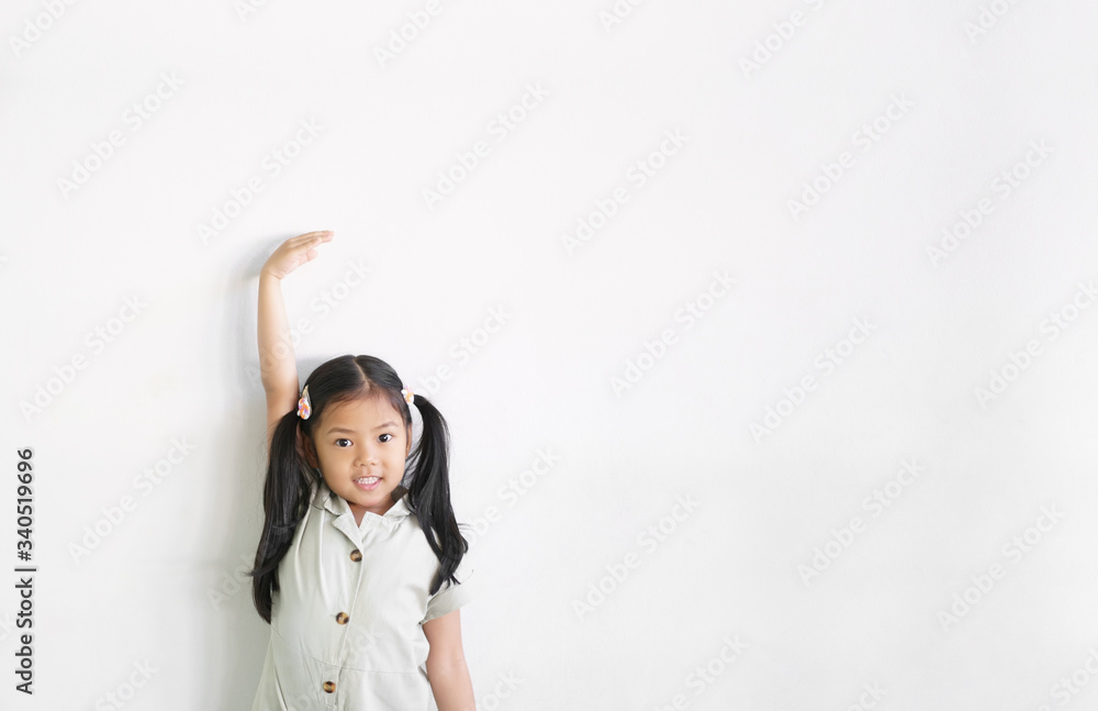 asian child cute or kid girl happy smiling show height or high and ...
