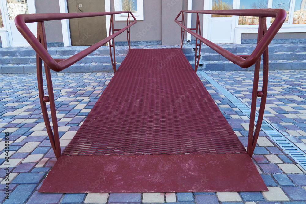 Wheelchair access ramp for entrance of residential multistory building ...