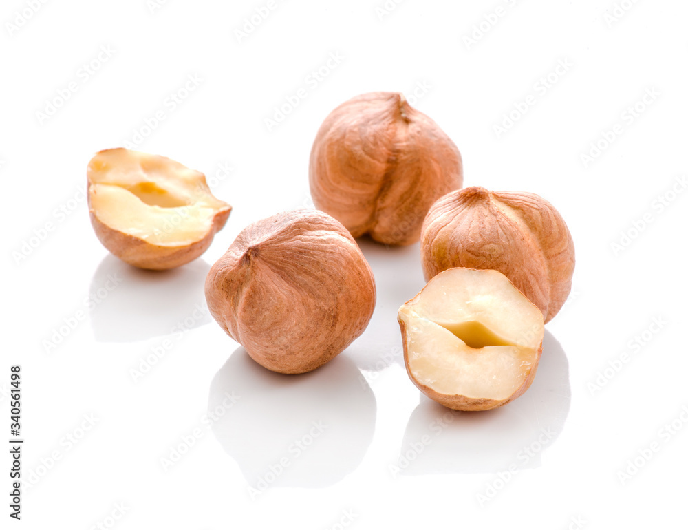 Full and halfs of hazelnuts on white background. Isolated Stock Photo ...