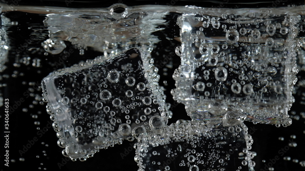 ice cube in fizzy splashing water with soda bubble Stock Photo | Adobe ...