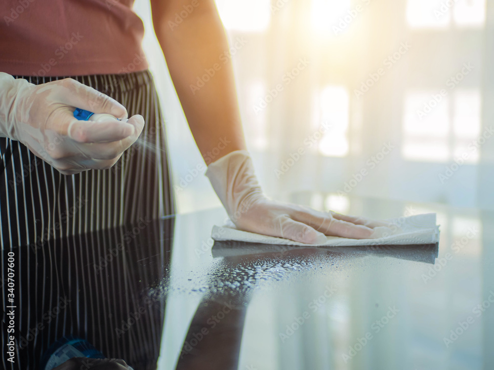 COVID-19 prevention sanitizing inside. Cleaning home table sanitizing ...