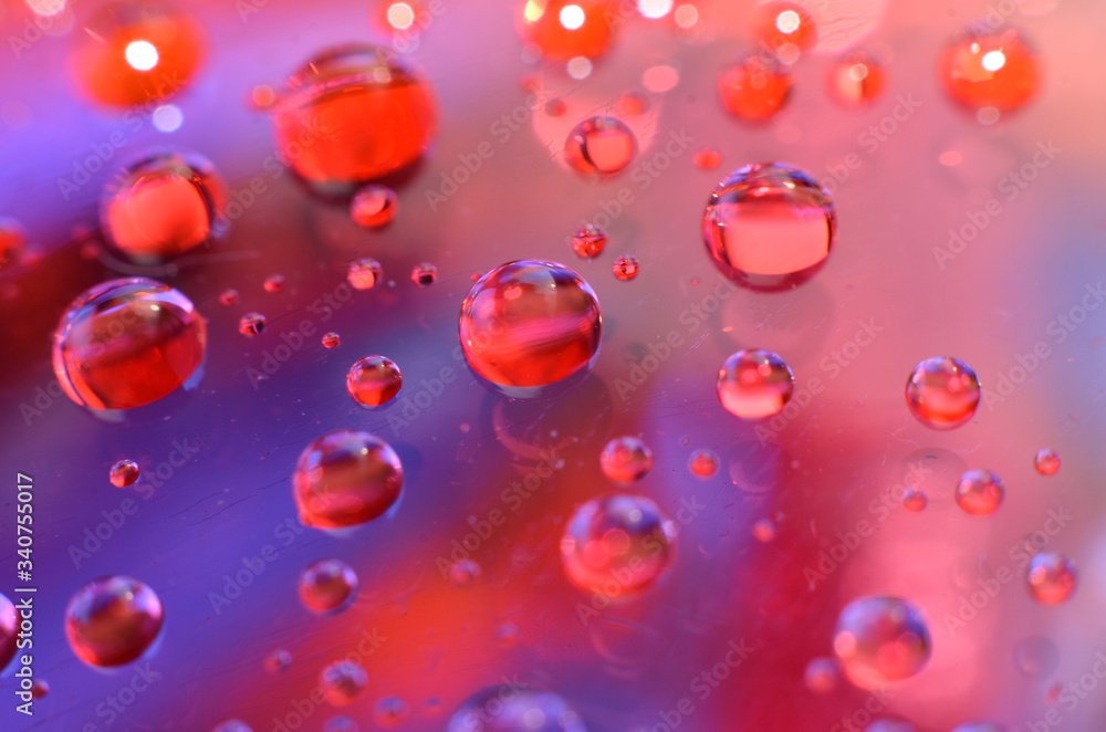 shiny clear water point attached to a glass reflects the same color as ...