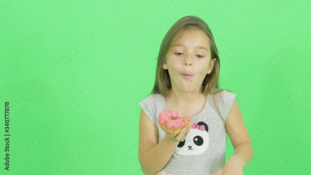 Little Girl Eating a Pink Donat Cute Funny preschool child Eating Happy ...