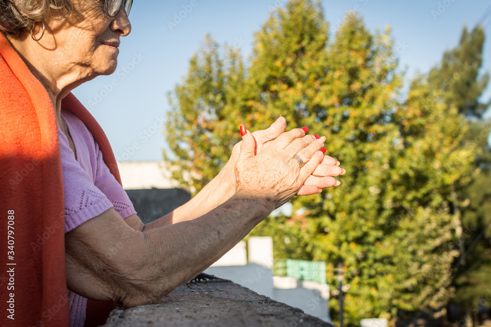 Hands clapping in a balcony ( Close up). happy grandmother applauding ...