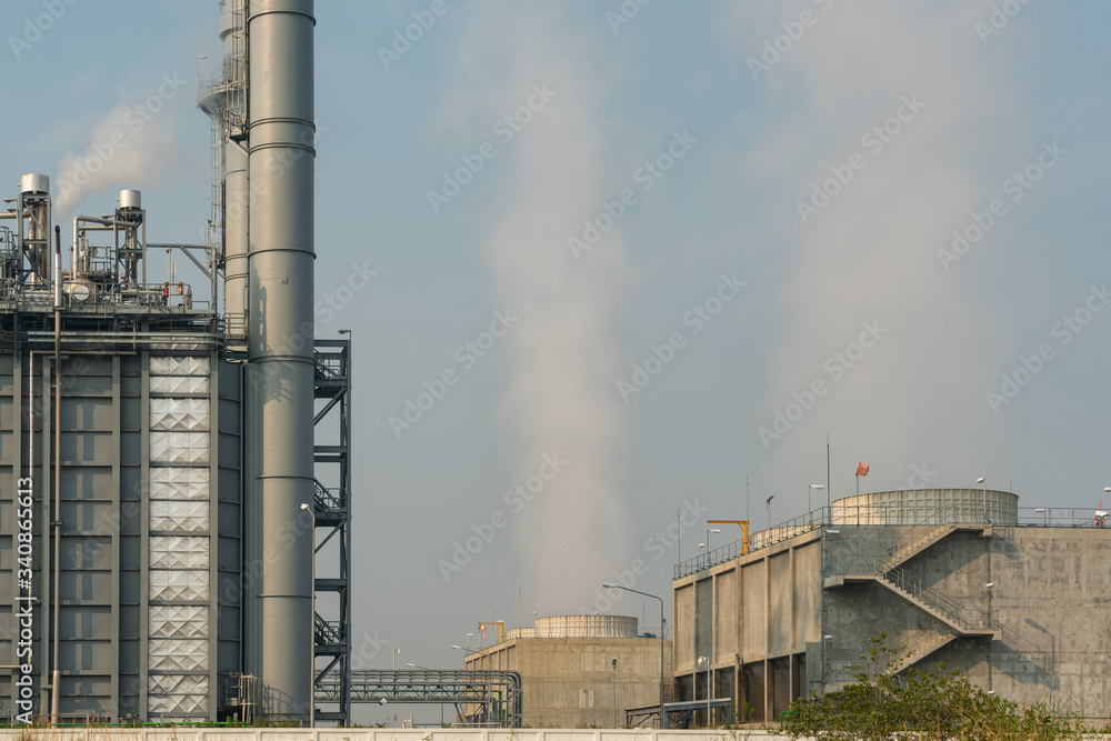 Power plant on blue sky. Chimney of thermal power plants. Gas turbine ...