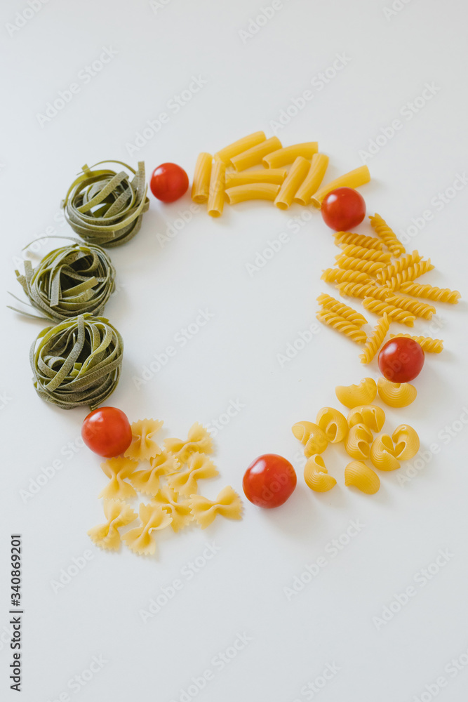 Variety of types and shapes of Italian pasta in rows on white ...