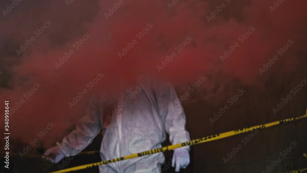 A Man In Hazmat Suit And Gas Mask Surrounded By Thick Color Orange ...