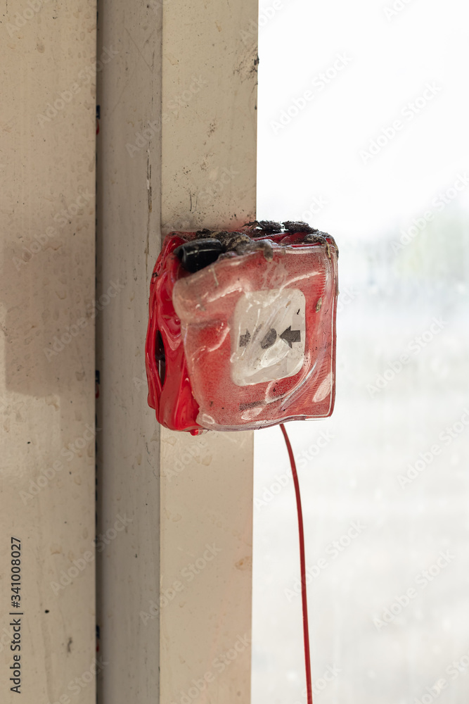 damaged fire alarm in the building after a fire. manual fire alarm ...