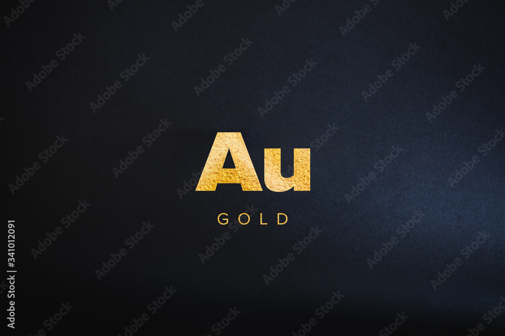 Gold, a precious metal and a chemical element with the symbol Au. Black ...