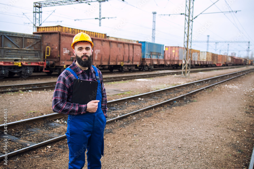 Railroad freight transportation. Portrait of railroader man worker with ...