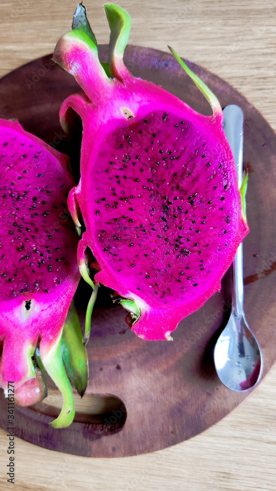 Fresh pitahaya fruit sliced on wooden background or ripe dragon fruit ...