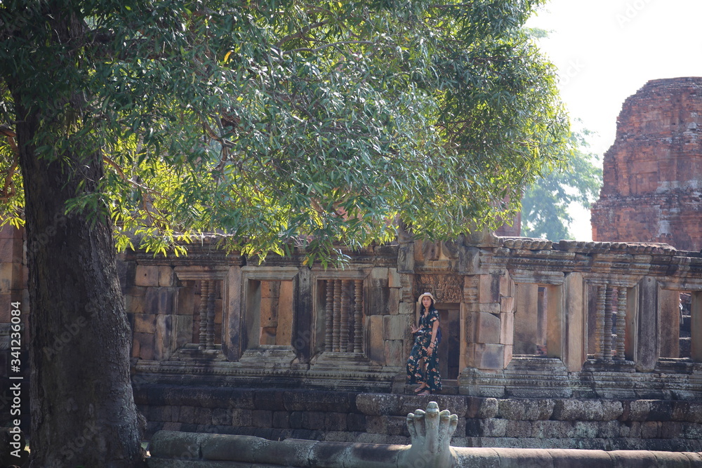 The woman is at the entrance of Prasat Mueang Tam (Mueang Tam castle ...