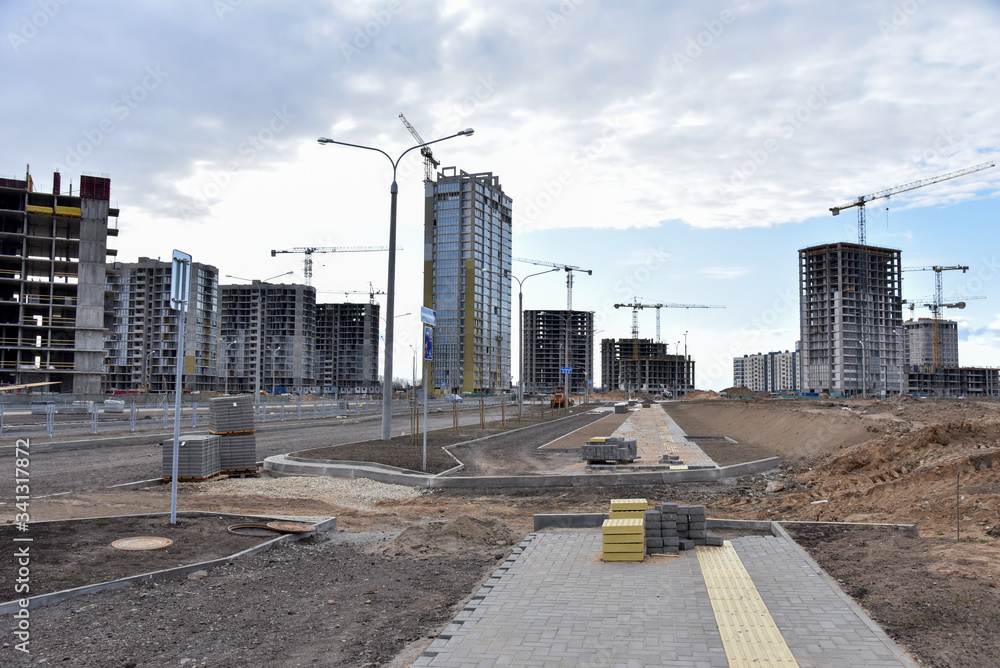 Laying paving slabs at construction site. Process of installing paving ...