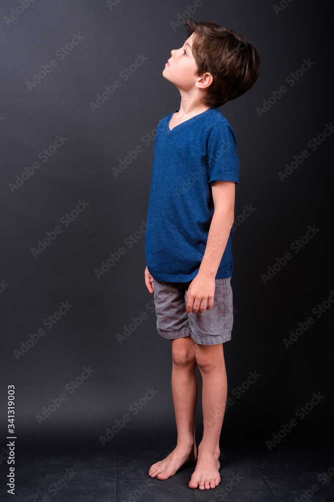 Full body shot of young handsome boy thinking and looking up Stock ...