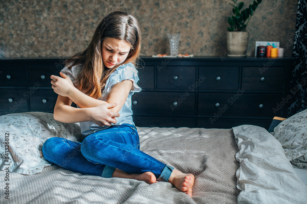 Women with elbow pain. Acute pain in the elbow. Young woman holds her ...