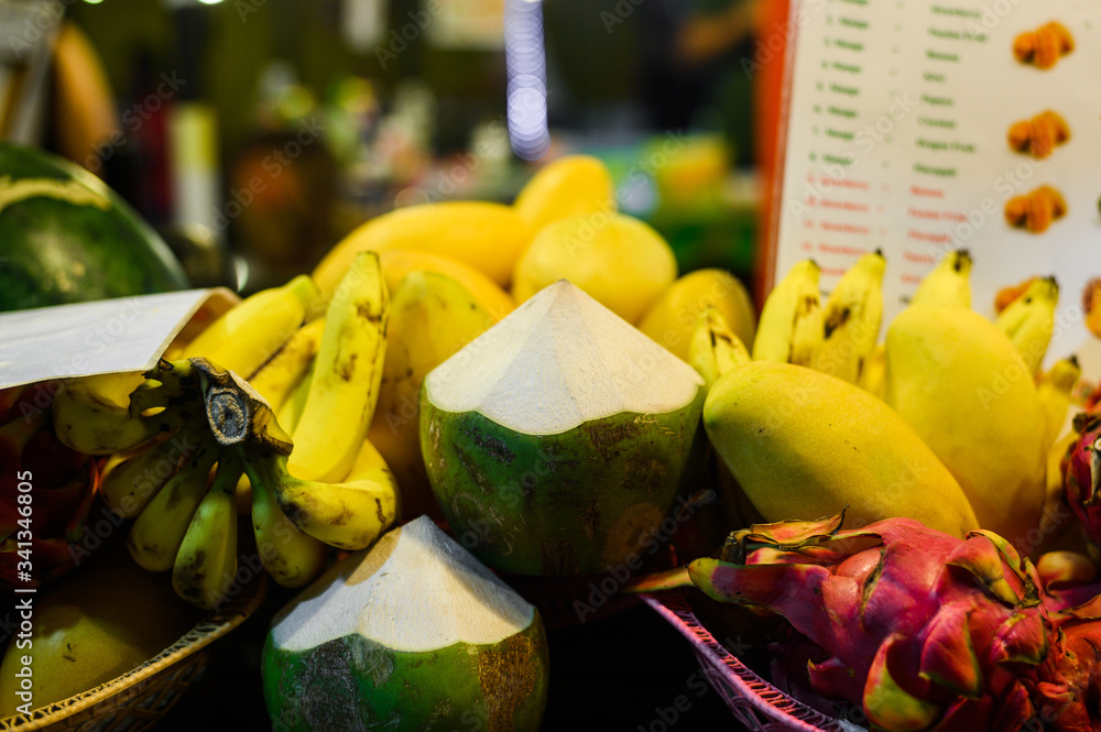 Tropical thai fruits stall at local food market in Thailand. Coconut ...