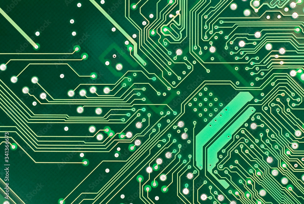 A detailed image of a small green microchip circuit board. Stock Photo ...