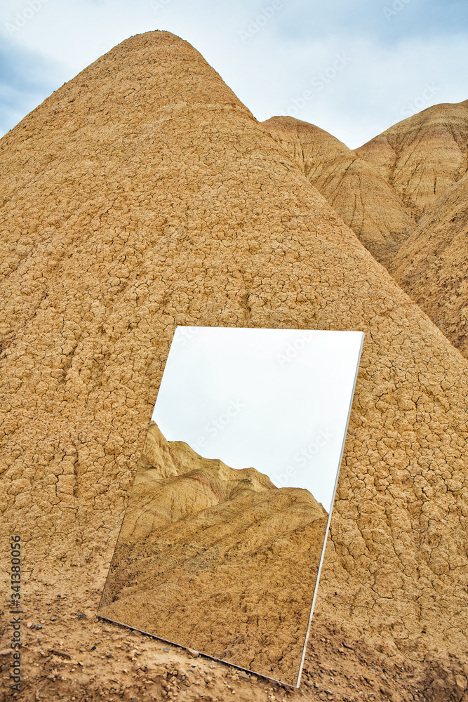 Reflection of desert landscape in mirror Stock Photo | Adobe Stock