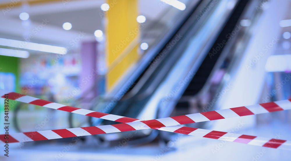 Hazard safety stripes across empty shopping mall elevator Stock Photo ...