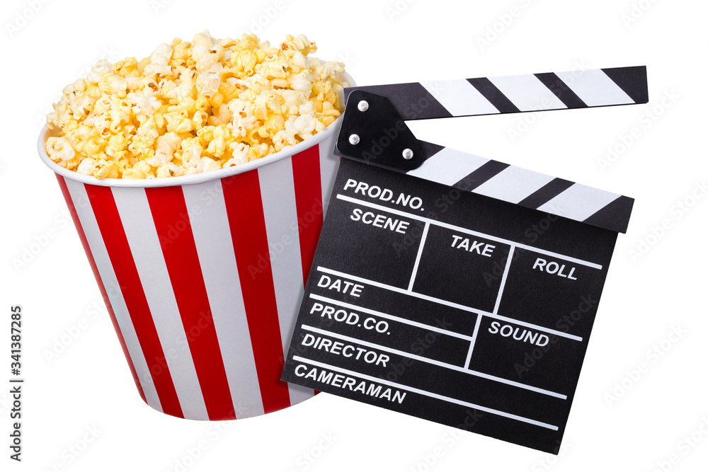 Flying popcorn and film clapper board isolated on black background ...