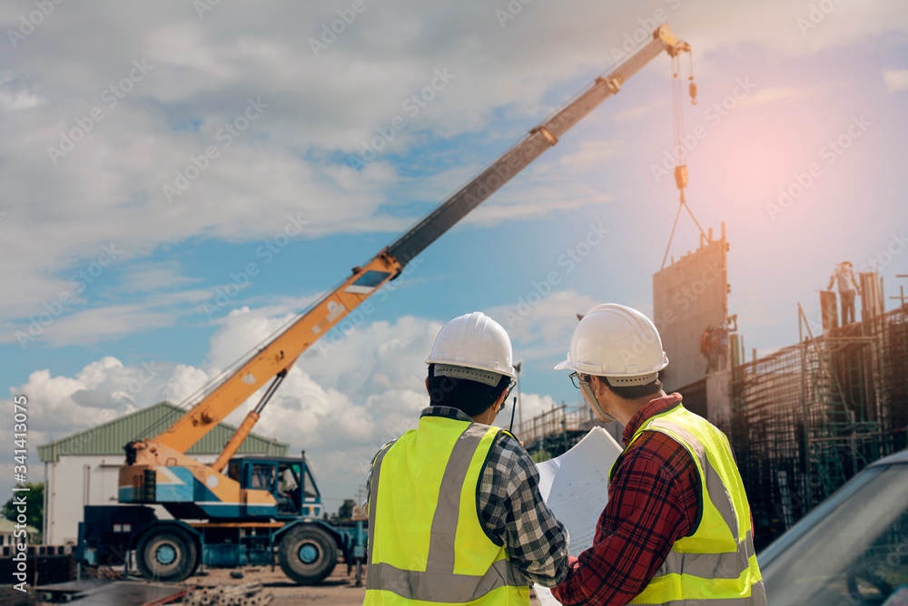 Two engineer discuss plan crane up lift Shutter boards for concrete ...