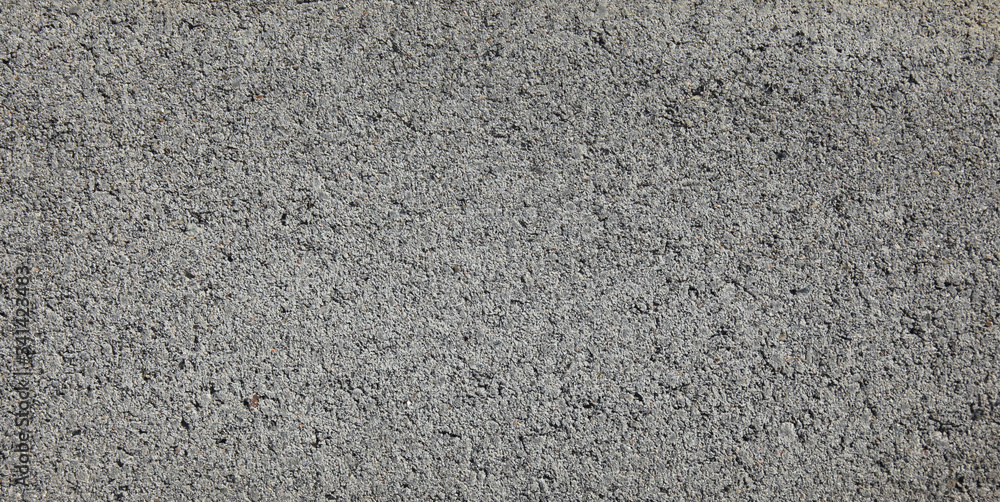 Grey grainty surface. Cinder block wall, texture and background. The ...