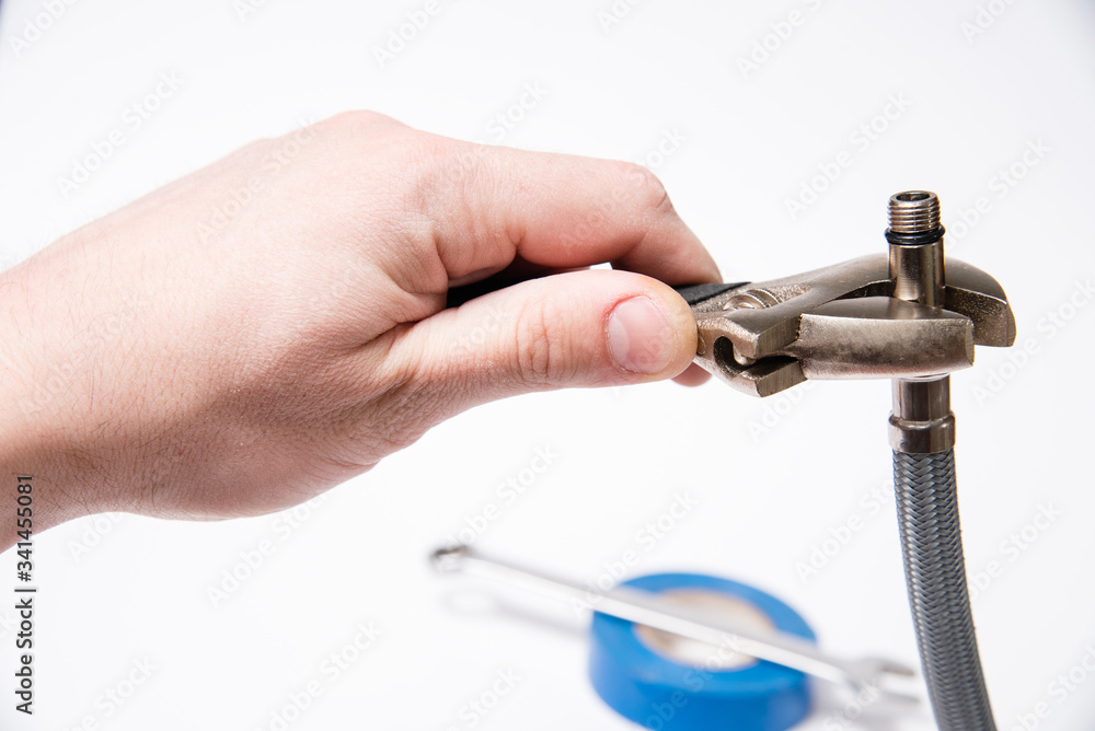 Process water hose installation. Hand of repairman worker with ...