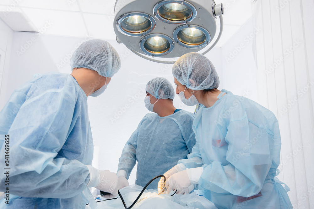 Operation in a modern operating room close-up, emergency rescue and ...