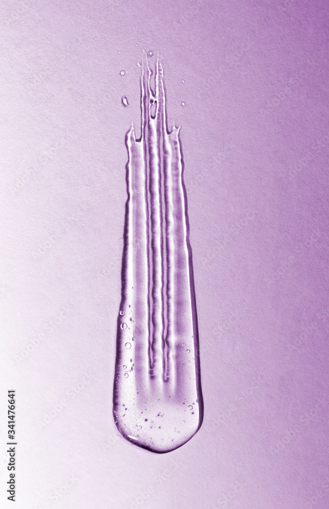 Transparent gel with bubbles close-up. Smear of face gel cream. The ...