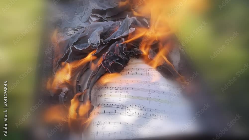 musical notes burn in the flame. The end of inspiration. The writer's ...