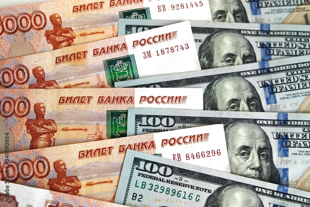Russian 5000 rubles and 100 dollars close up, concept of finance is ...