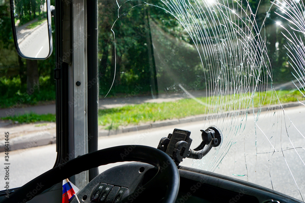 broken windshield of a bus, traffic accident, assault, pedestrian ...