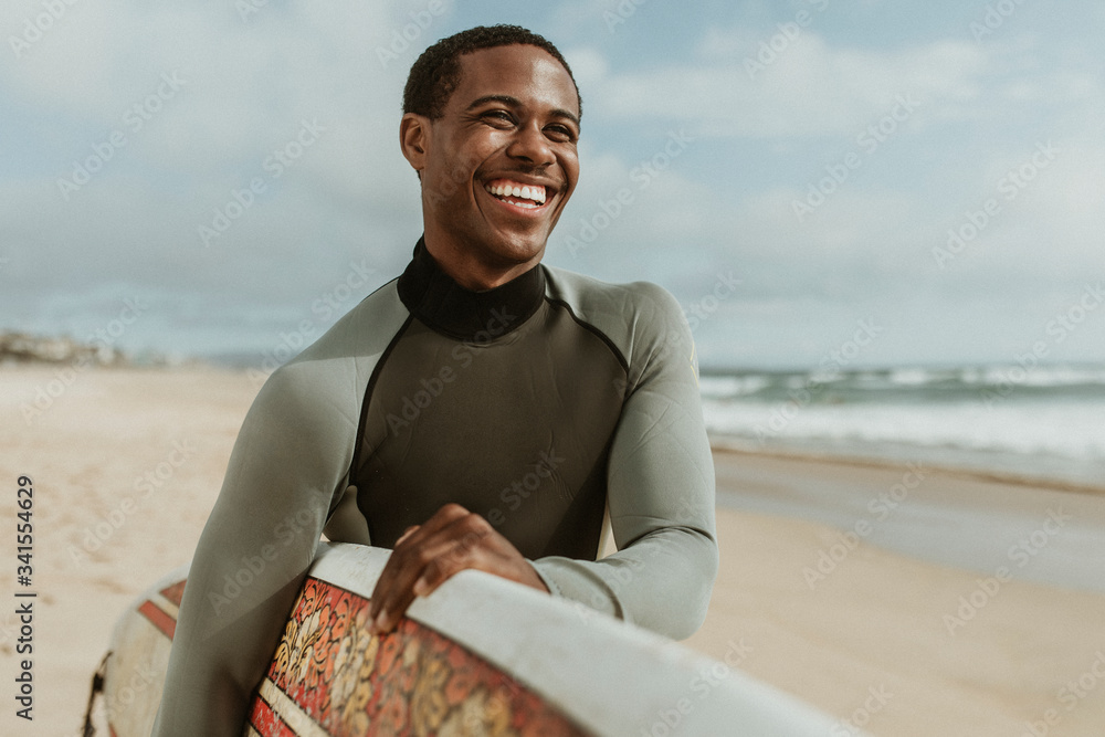 Smiling male surfer Stock Photo | Adobe Stock