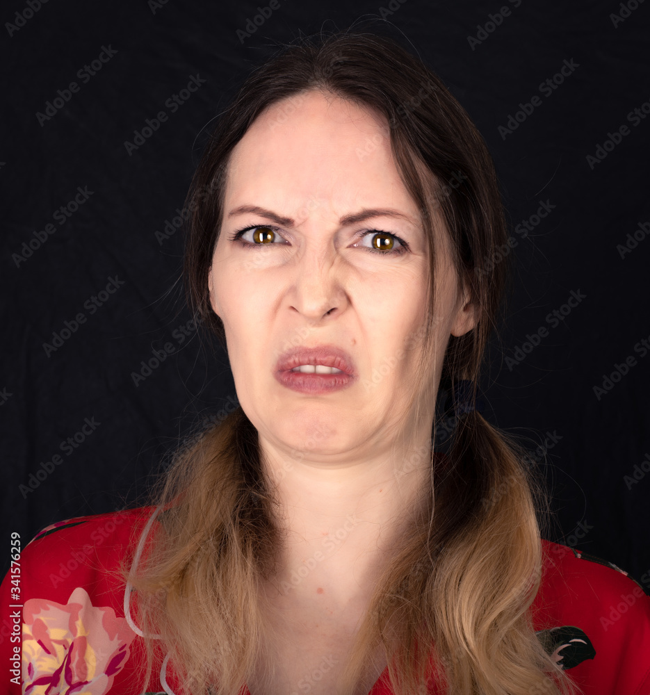 Emotion. Closed woman face with facial expressions over black ...