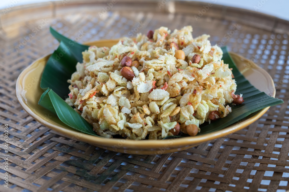 "Khao Mao Mee", Thai Crispy fried pounded unripe rice snack on basket ...
