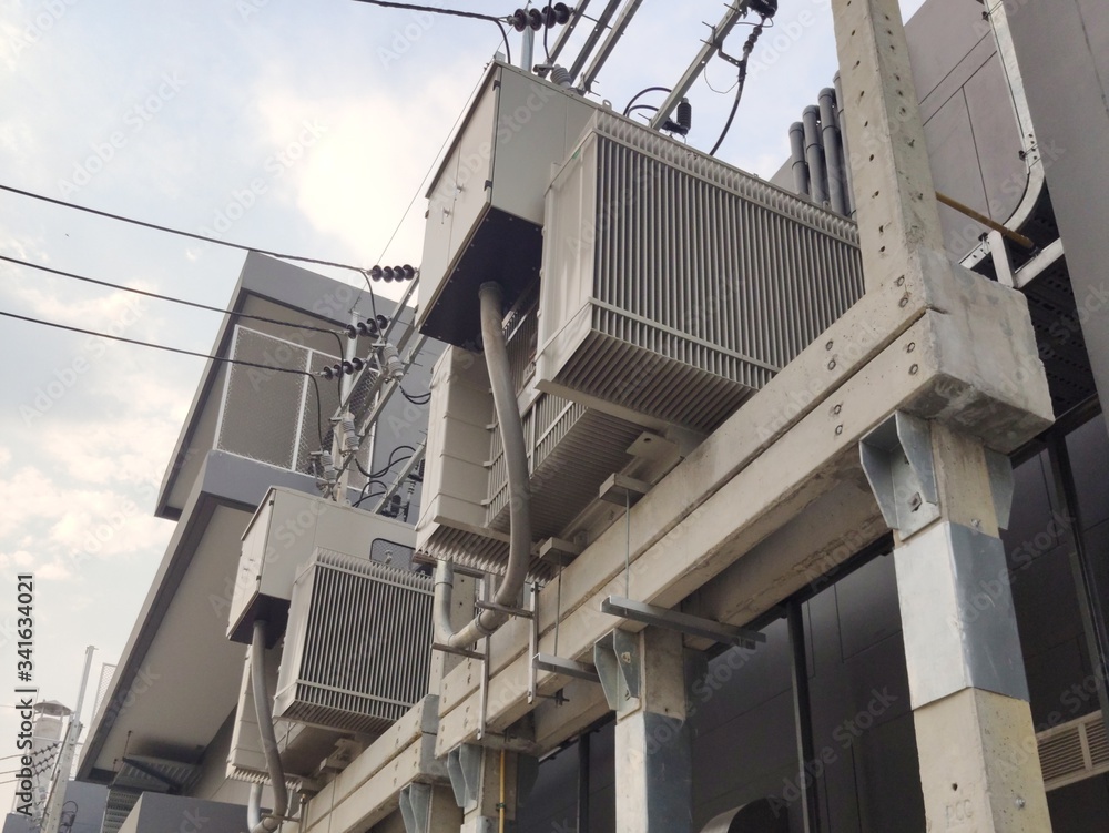 AC high-voltage power transformers and high voltage cables on the pole ...