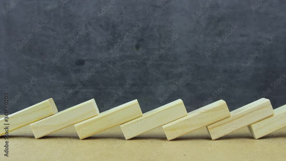 Social distance during a pandemic concept. Side view of falling wooden ...