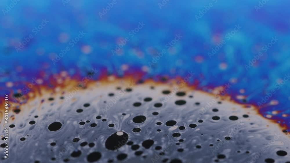 Vidéo Stock Small cells moving on a rainbow colored surface. Color ...