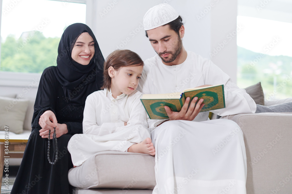 muslim family reading Quran and praying at home Stock Photo | Adobe Stock